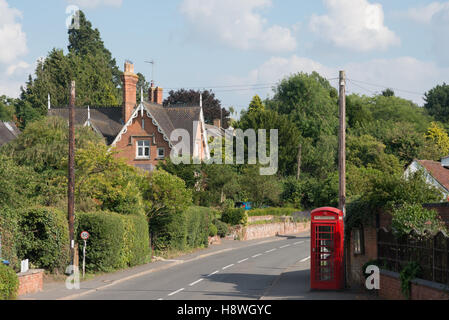 A red phone box and house, Snitterfield, Warwickshire, England, UK ...
