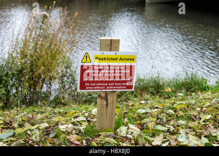 Japanese knotweed warning sign placed on an area of river bank in ...