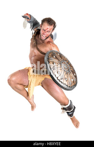 Ancient warrior or Gladiator jumping isolated in a white background ...