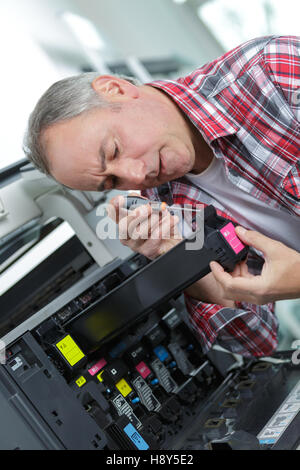 repairing a printer at work Stock Photo - Alamy