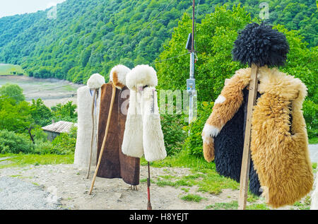 Traditional Georgian shepherd dress, hat or papakha and coat of sheep ...