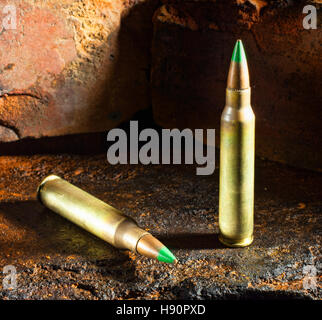 Armor-piercing bullet on a white background close-up, weapons and ...