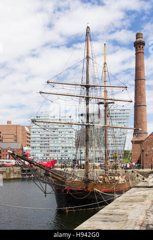 Two-masted square rigged tall ship "Windeward Bound" furls sails as it ...