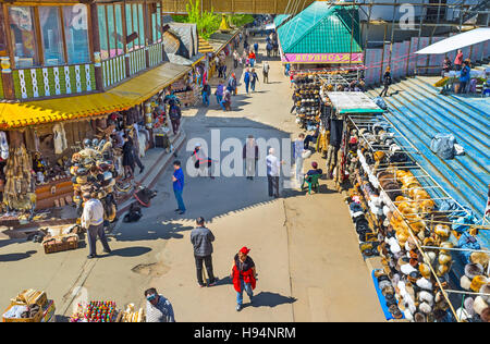 Traditional Russian market stall offering household products and items ...