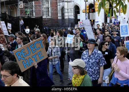 Protesters carry signs and march past a townhouse owned by Minneapolis ...