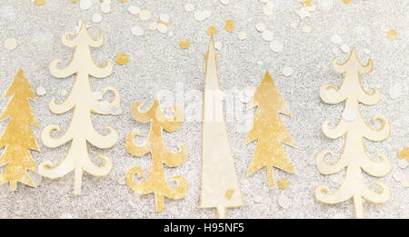Tinsel with christmas ornaments and blank paper note wooden background ...