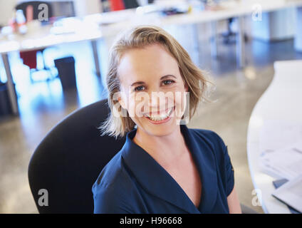 Portrait of mature businesswoman working on laptop in office. panoramic ...
