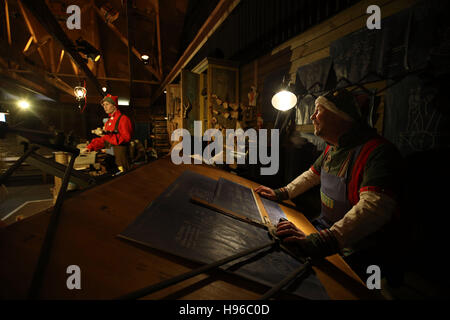 Elves work in the toy factory at SantaPark, in Rovaniemi, Finland ...