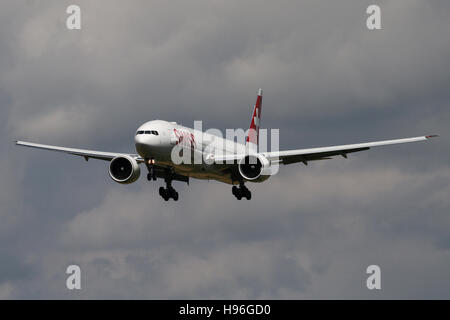 Swiss Boeing 777 landing at Zurich Airport. Airplane 777-300ER of Swiss ...