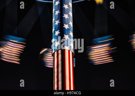 Spinning Swings at Amusement Park Stock Photo - Alamy