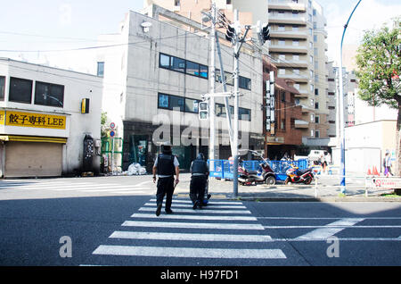 Japanese people armored guard transporting money or security guard for ...