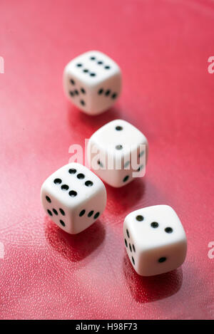 White and red dice on white desk with reflection. Isolated over white ...