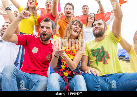 Soccer fans cheering and shouting in stadium Stock Photo - Alamy