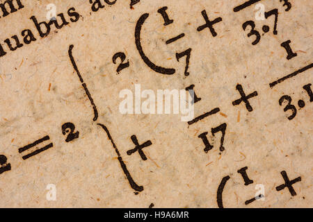 Yellowed page of a 200 years old mathematics book with complex ...