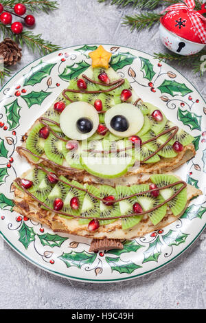 Christmas tree shaped sweet crepe with blueberries Stock Photo - Alamy