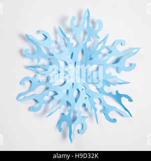 Fine paper snowflake cut out Stock Photo - Alamy