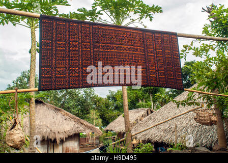 Ngada woman weaving ikat cloth Bena Village Flores Indonesia Southeast ...