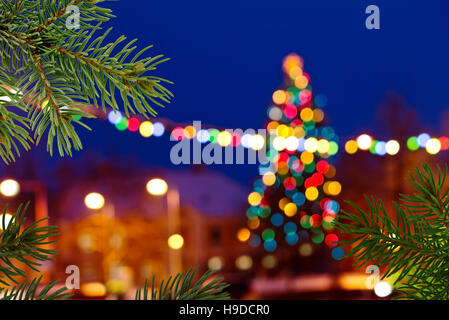 Christmas background with unfocused Christmas tree by night Stock Photo ...