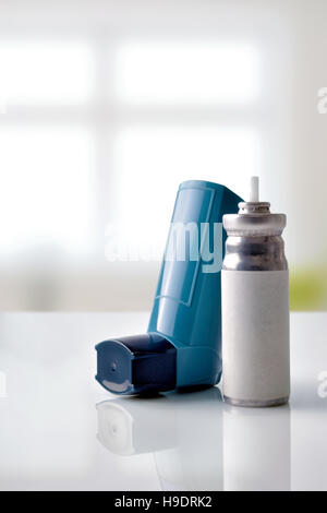 Asthma inhaler on table in bedroom, closeup Stock Photo - Alamy