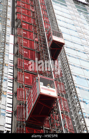 Temporary personnel and goods hoists on a construction project in ...