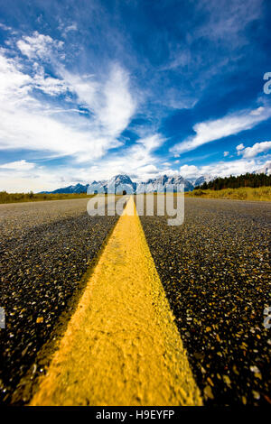 Low angle view of yellow strip on a Southern California desert road ...