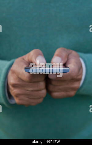 senior guy texting and messaging on smartphone isolated on white. guy ...