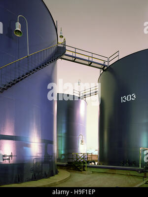 Blue storage tanks outdoors for storing chemicals at manufacturing ...