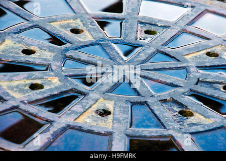 Old steel manhole cover plate over a water main valve in Spokane ...