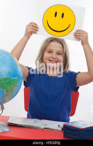 Happy school age kids hold triangular rulers yellow background ...
