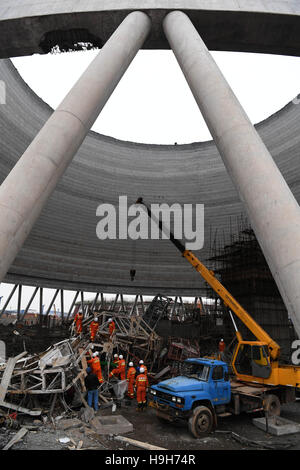 Rescuers work at the accident site at the Fengcheng power plant in ...