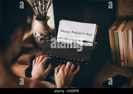 Woman using vintage typewriter in garden on spring day Stock Photo - Alamy