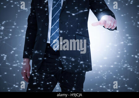 Composite image of mid-section of business man using a tablet Stock ...