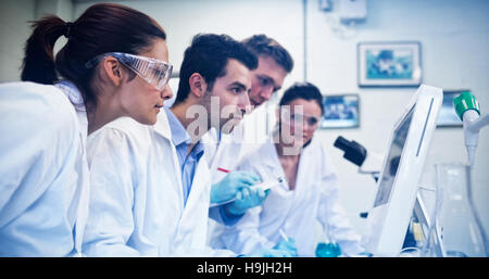 Researchers looking at computer screen in the lab Stock Photo - Alamy