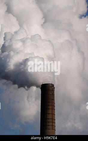 Industrial air pollution. Smoke billowing from a steel mill's chimney ...