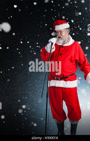Santa Claus is singing Christmas songs on white background Stock Photo ...