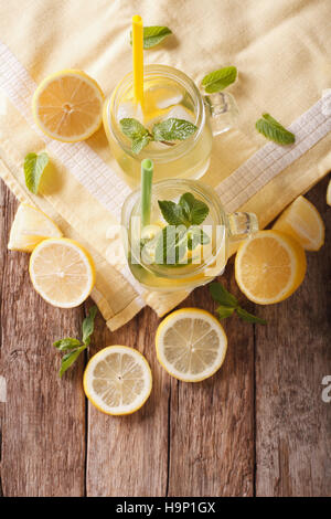 Glass of tasty cold lemonade on color background Stock Photo - Alamy