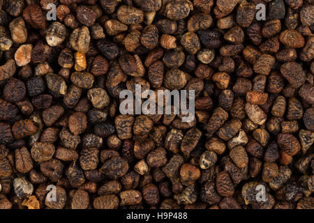Decorticated cardamom seeds close up image can be used for background ...