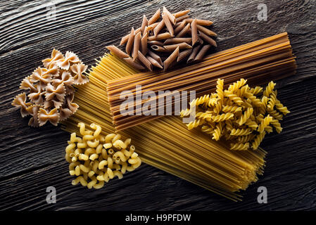 italian spaghetti on wooden background Stock Photo - Alamy