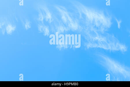Mostly clear sky with small nice white cloud Stock Photo - Alamy