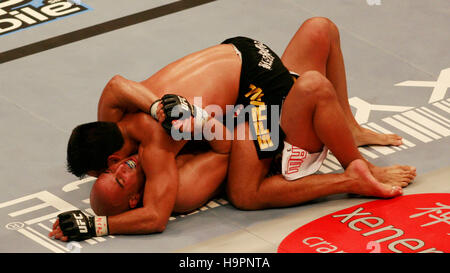 Lyoto Machida, top, fights Sam Hoger at the Ultimate Fighting Champion ...