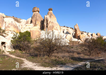 Fairy Chimneys. Fairy chimneys and road in the Goreme Cappadocia Turkey ...