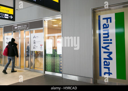 A FamilyMart signboard on display at the entrance of its convenience ...