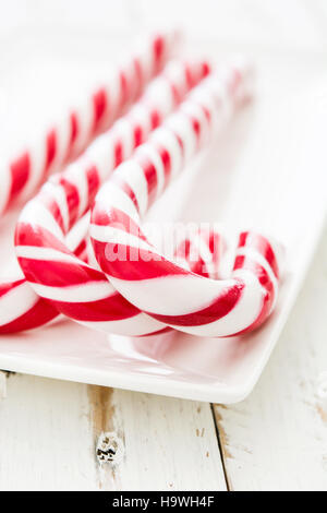 Candy on a white wooden background, top view. From above, flat lay ...