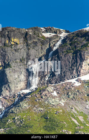A scenic view of the waterfalls above Avalanche Lake in Glacier ...