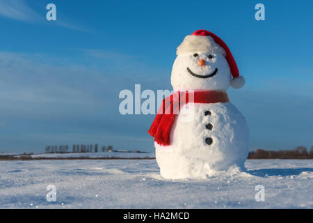 snowman on blue sky background Stock Photo - Alamy