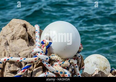 Floating the mark on the rock Stock Photo - Alamy