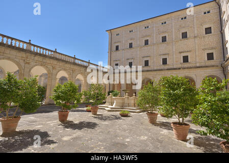 Interior terrace of a castle with flowers and a fountain. Tuscany ...