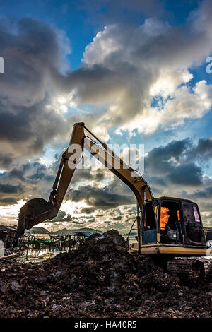 Excavator operator downtime waiting Stock Photo - Alamy