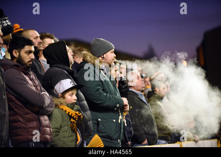 Man vaping in crowd at football match Britain Uk smoking exhaling vape ...