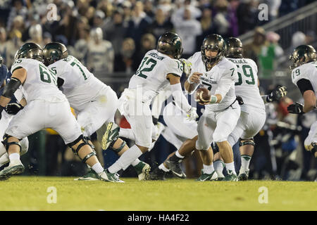 Michigan State quarterback Tyler O'Connor (7) runs during the first ...